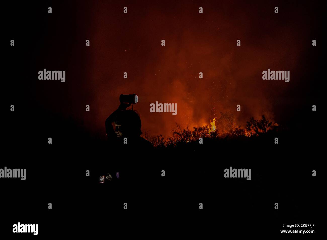 This picture taken on October 06, 2019 shows an Indonesian firefighter ...