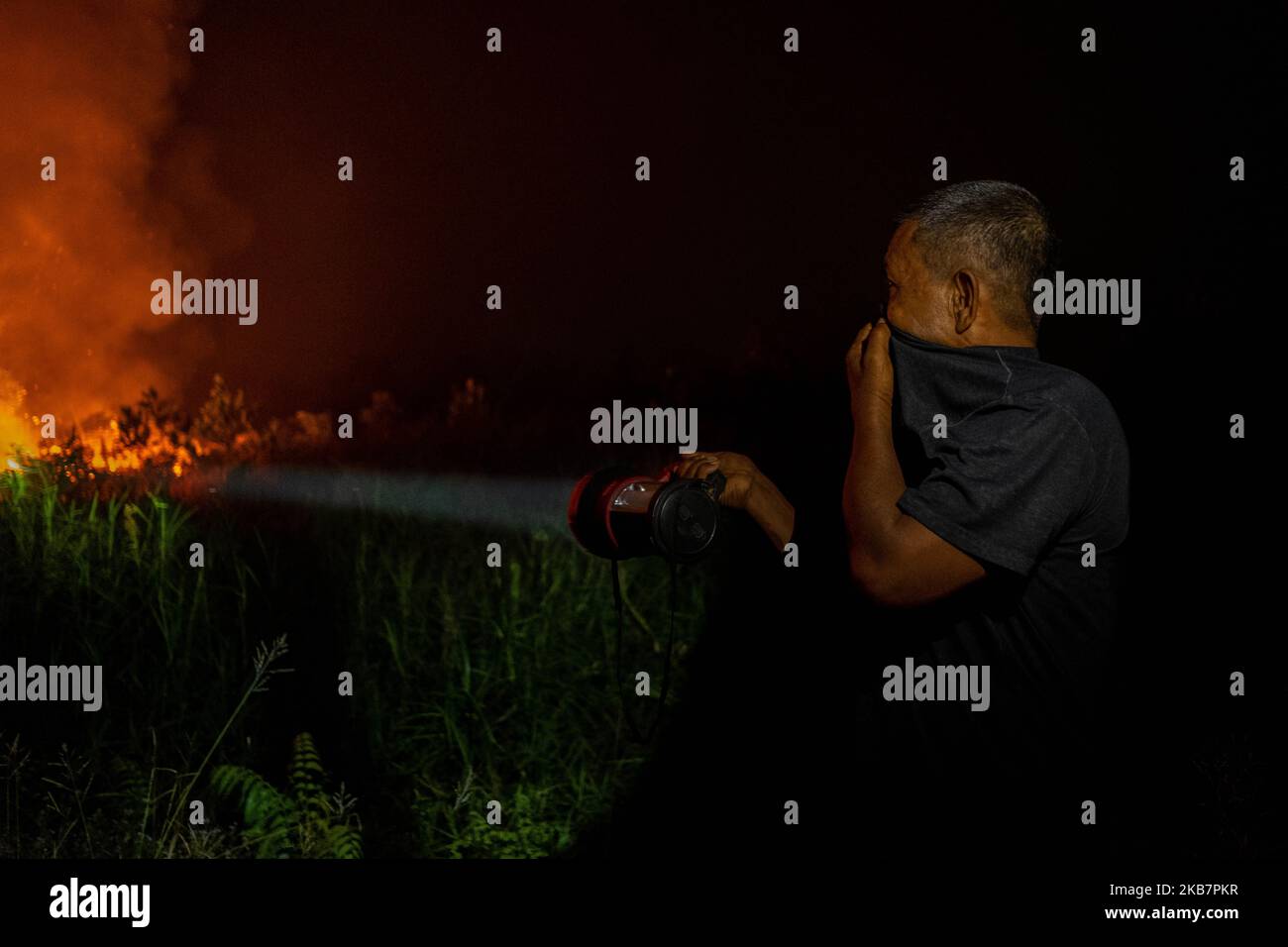 This picture taken on October 06, 2019 shows an Indonesian firefighter ...