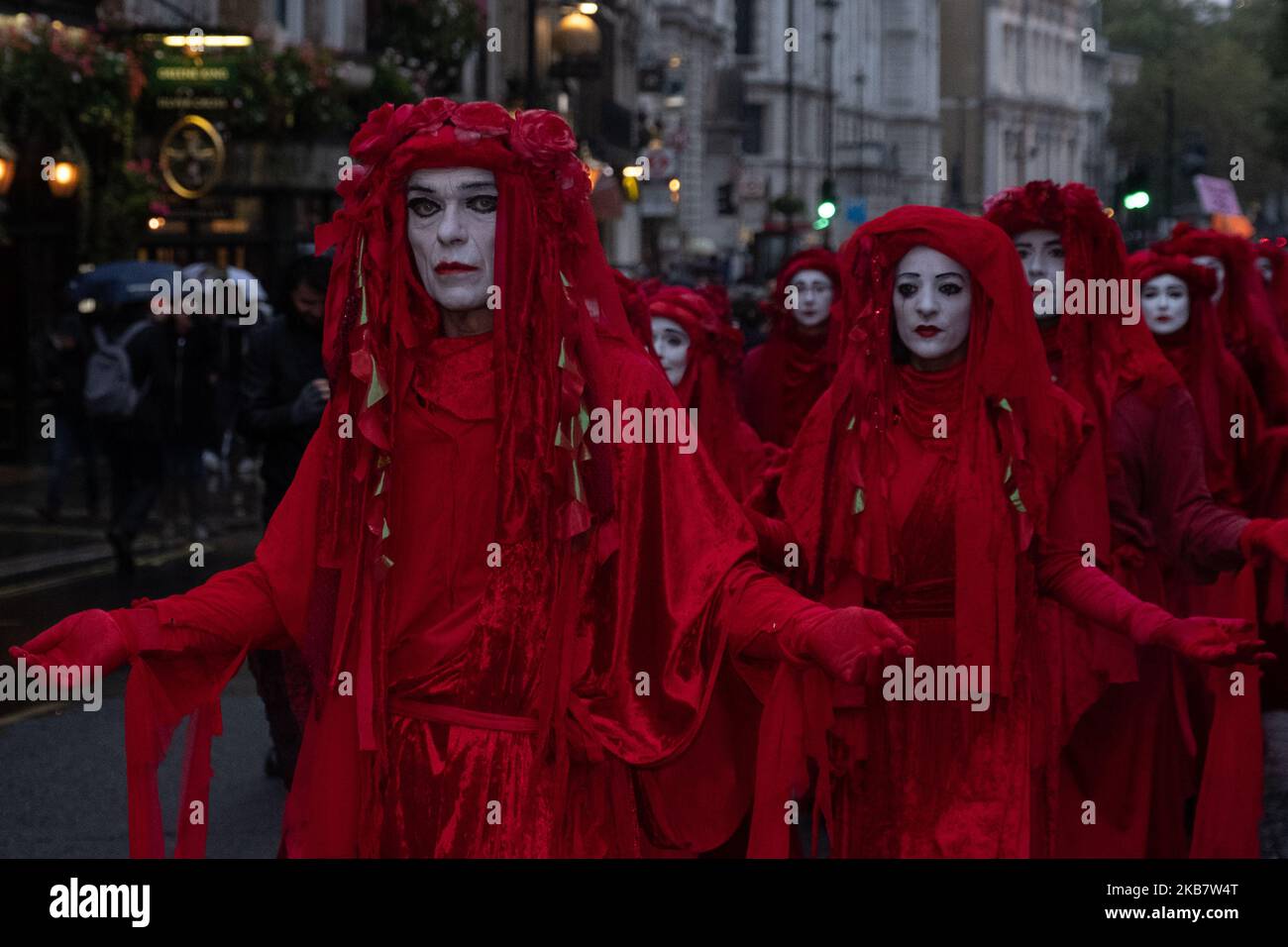 The Red Brigade of The Invisible Circus walk by the Houses of ...