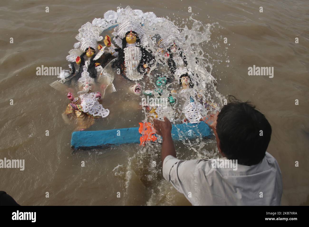 Hindu goddess DurgaÂ into the Ganges river Â during the immersion ...