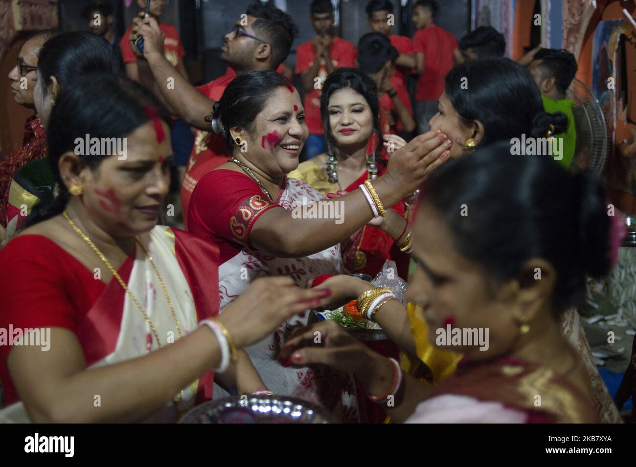 Hindu married women playing with vermilion powder as a part of their ...