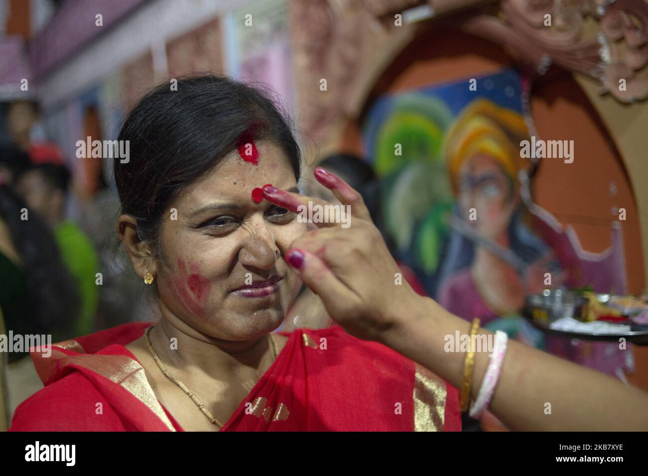 Hindu married women playing with vermilion powder as a part of their ...