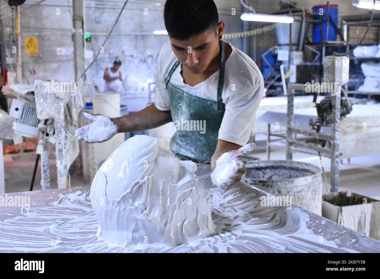 A man works manufacturing a latex mask of Singer Jose Jose at REV ...
