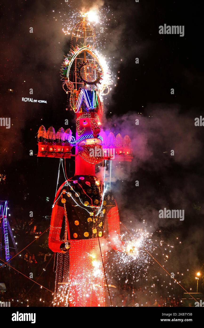 An effigy of demon king Ravana is set on fire during the Dusshera ...
