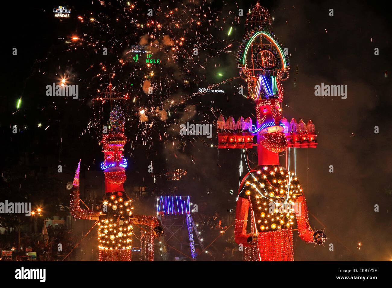 An effigy of demon king Ravana is set on fire during the Dusshera ...