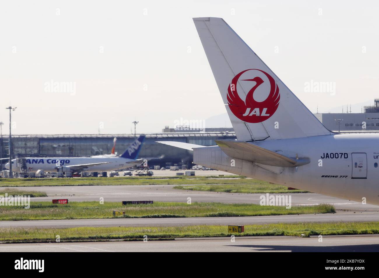 Japan Airlines Co. (JAL) aircraft stand at Haneda Airport in Tokyo ...