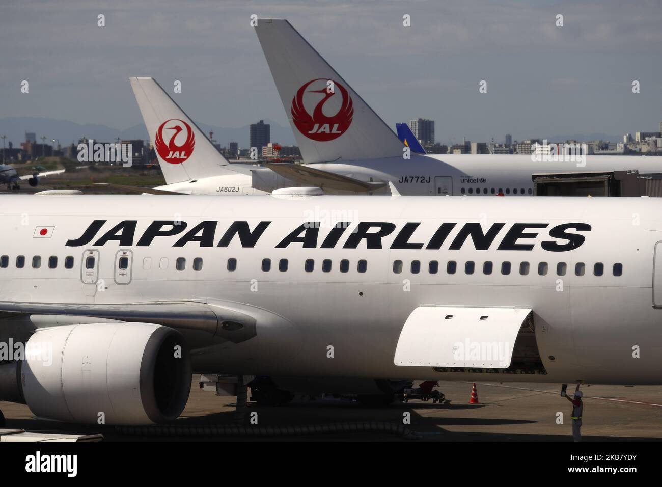 Japan Airlines Co. (JAL) aircraft stand at Haneda Airport in Tokyo ...