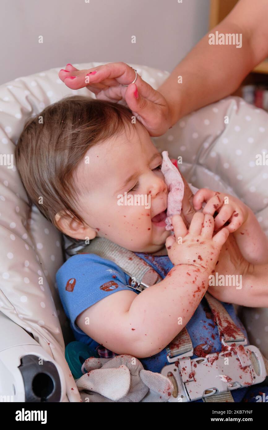 Child eating messy cake hi-res stock photography and images - Alamy