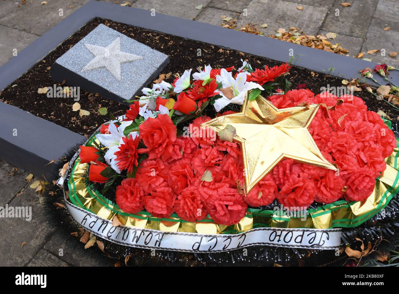 A remembrance wreath seen at one of the 74 graves with a Red Army star ...
