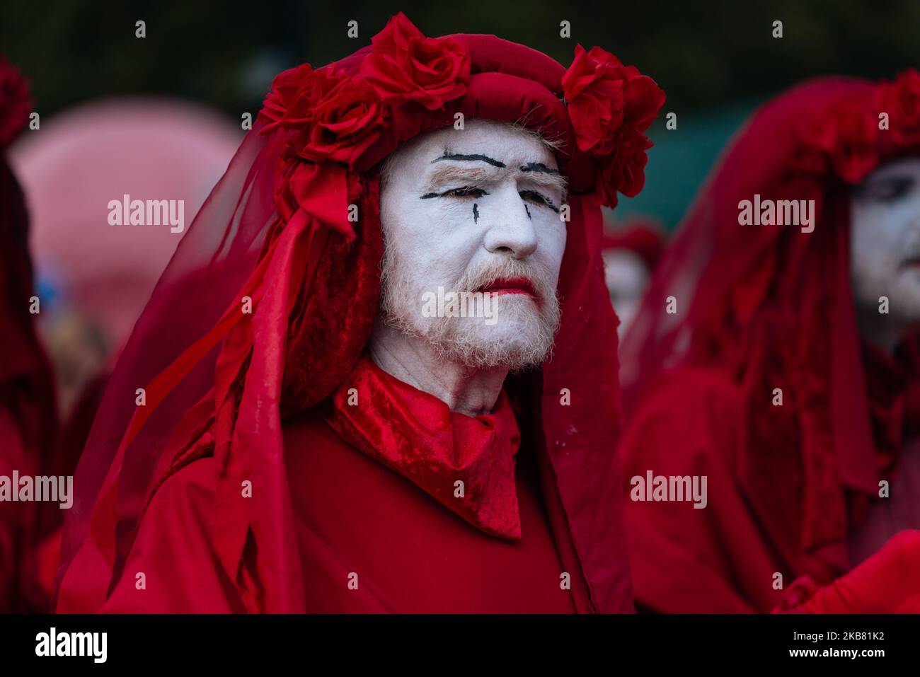 Activists dressed in red costume protest at Trafalgar Square during the ...