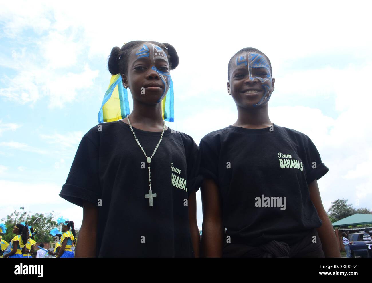 Two young girls with face painting pose for photograph during the ...