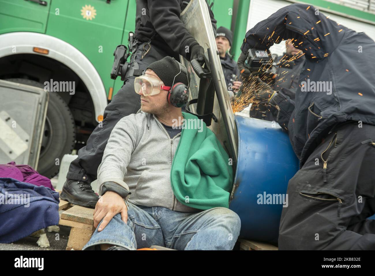 Police as Firefighters free some activists of Extinction Rebellion who ...