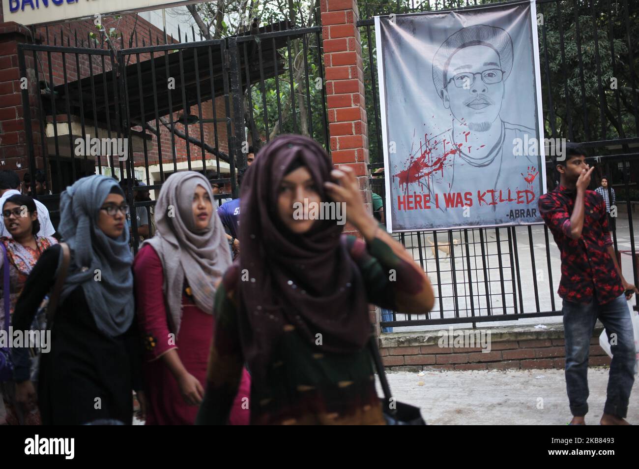 A poster of Abrar Fahad seen hanging with the main gate of BUET. Abrar ...