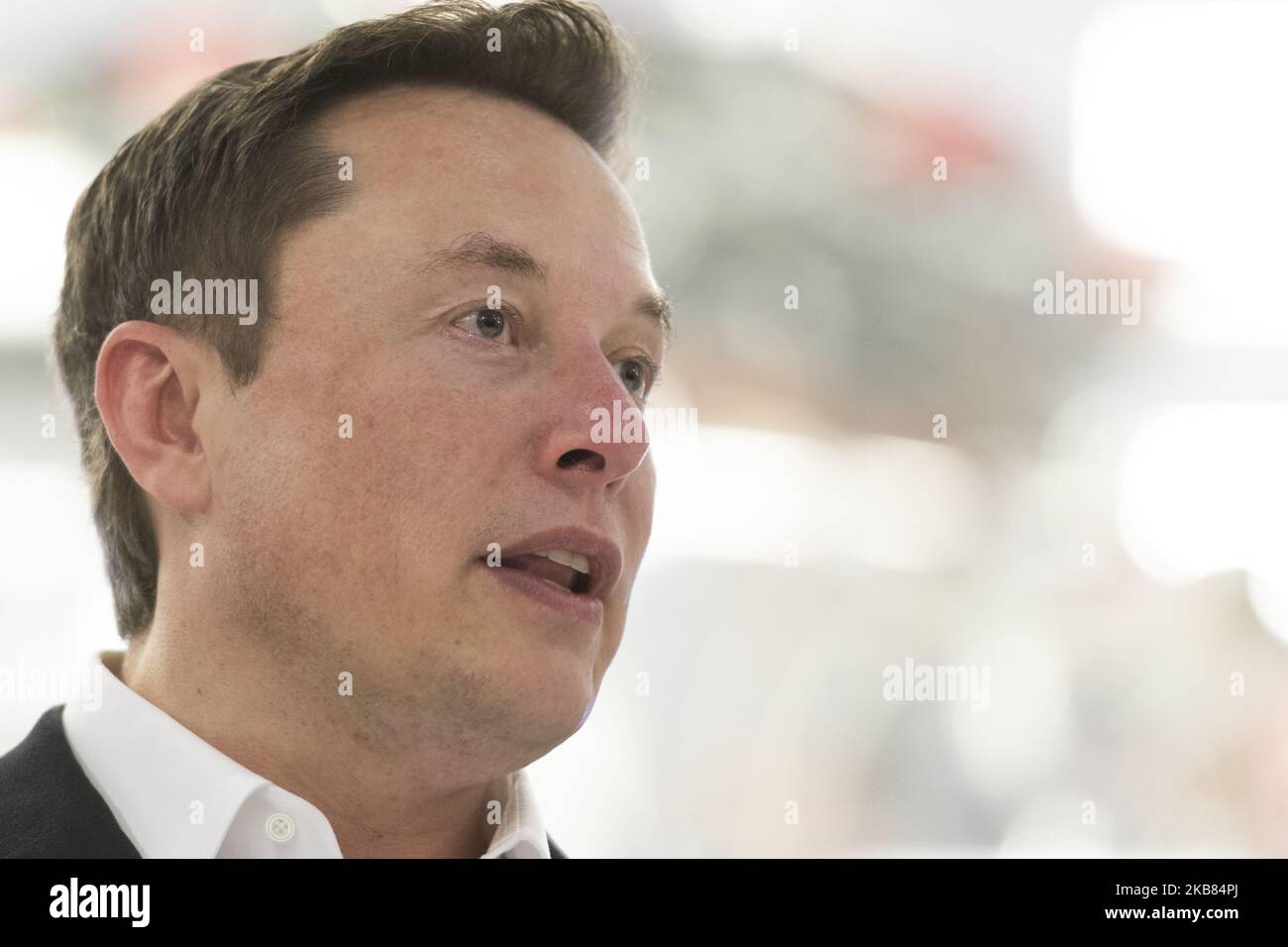 SpaceX Chief Engineer Elon Musk speaks in front of Crew Dragon ...