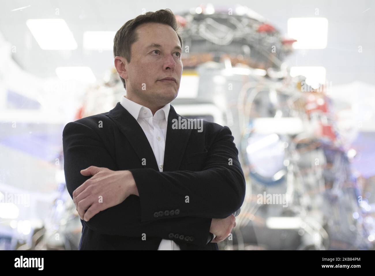 SpaceX Chief Engineer Elon Musk speaks in front of Crew Dragon ...