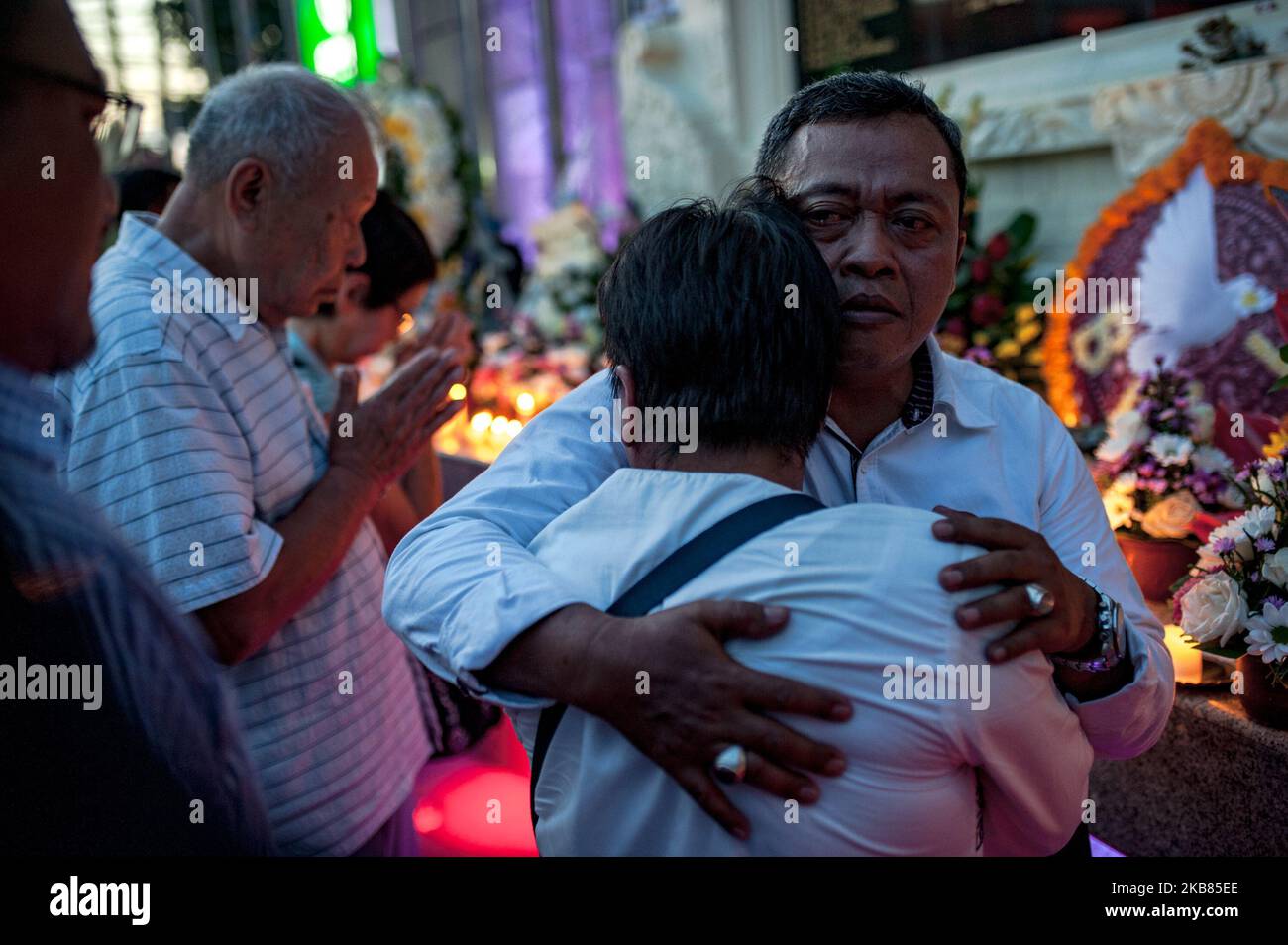 Two people hugged while crying to commemorate the 17th anniversary of ...
