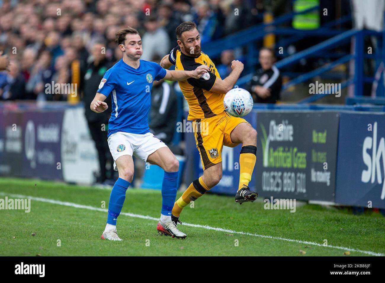 Theo Archibald of Macclesfield Town tackles Tom Pope of Port Vale ...