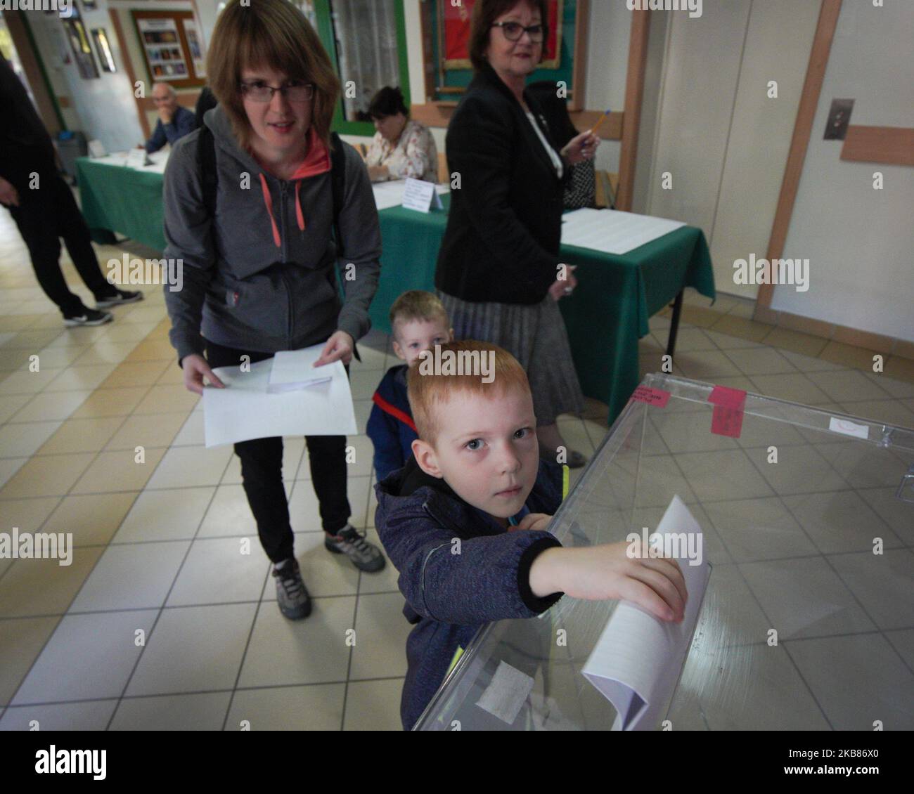 A child puts a vote in a ballot box in Warsaw, Poland on October 13 ...