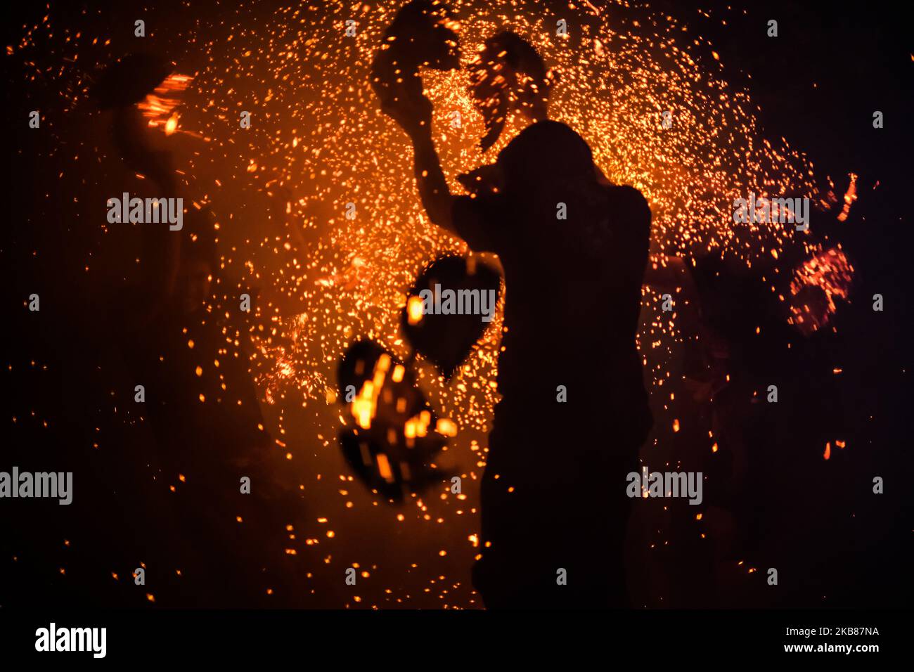 Dozens of Tuban village youths throwing coconut husks full of fire to ...