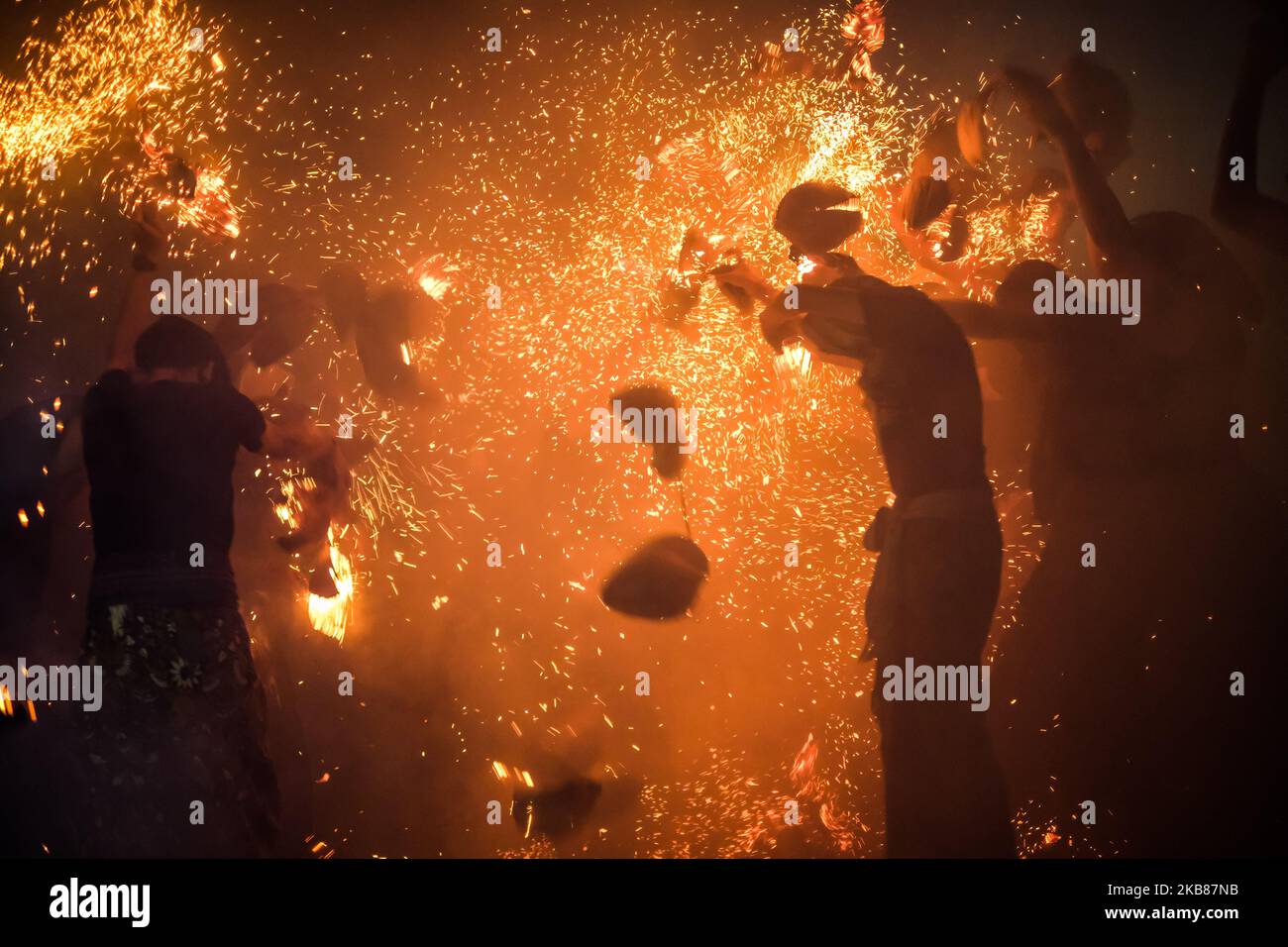 Dozens of Tuban village youths throwing coconut husks full of fire to ...
