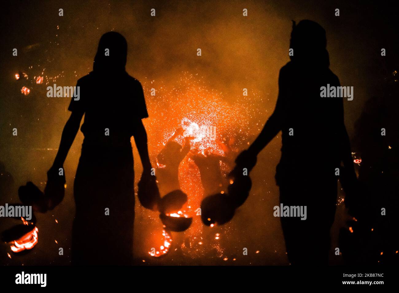 Dozens of Tuban village youths throwing coconut husks full of fire to ...