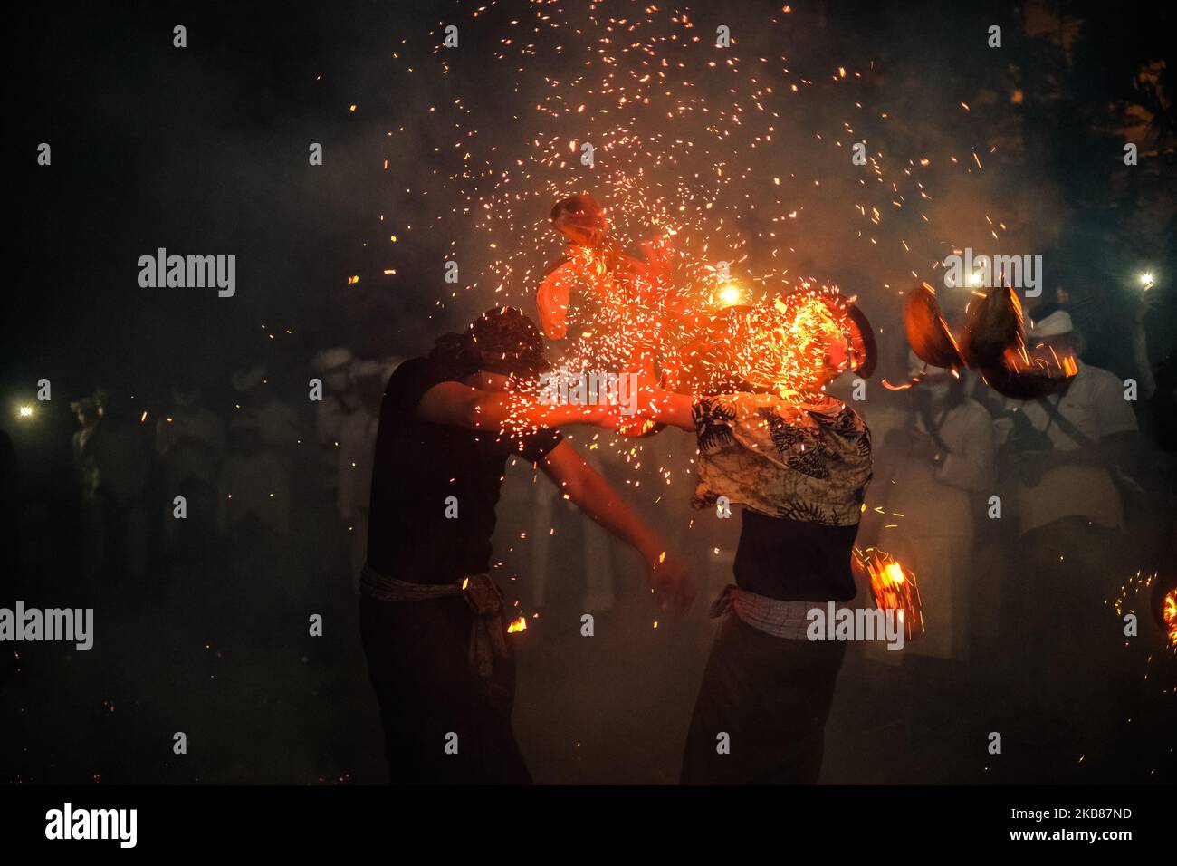 Dozens of Tuban village youths throwing coconut husks full of fire to ...