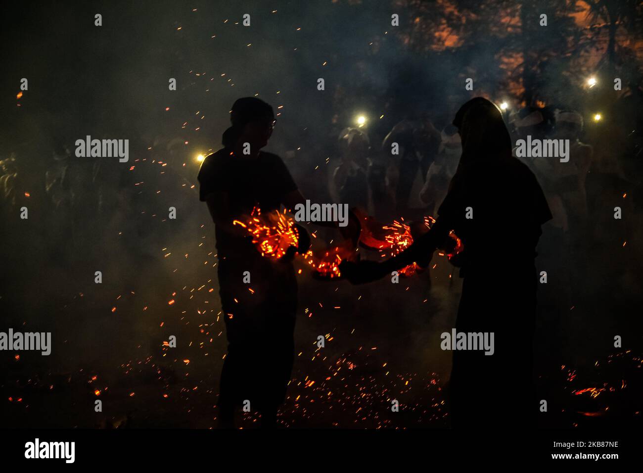 Dozens of Tuban village youths throwing coconut husks full of fire to ...