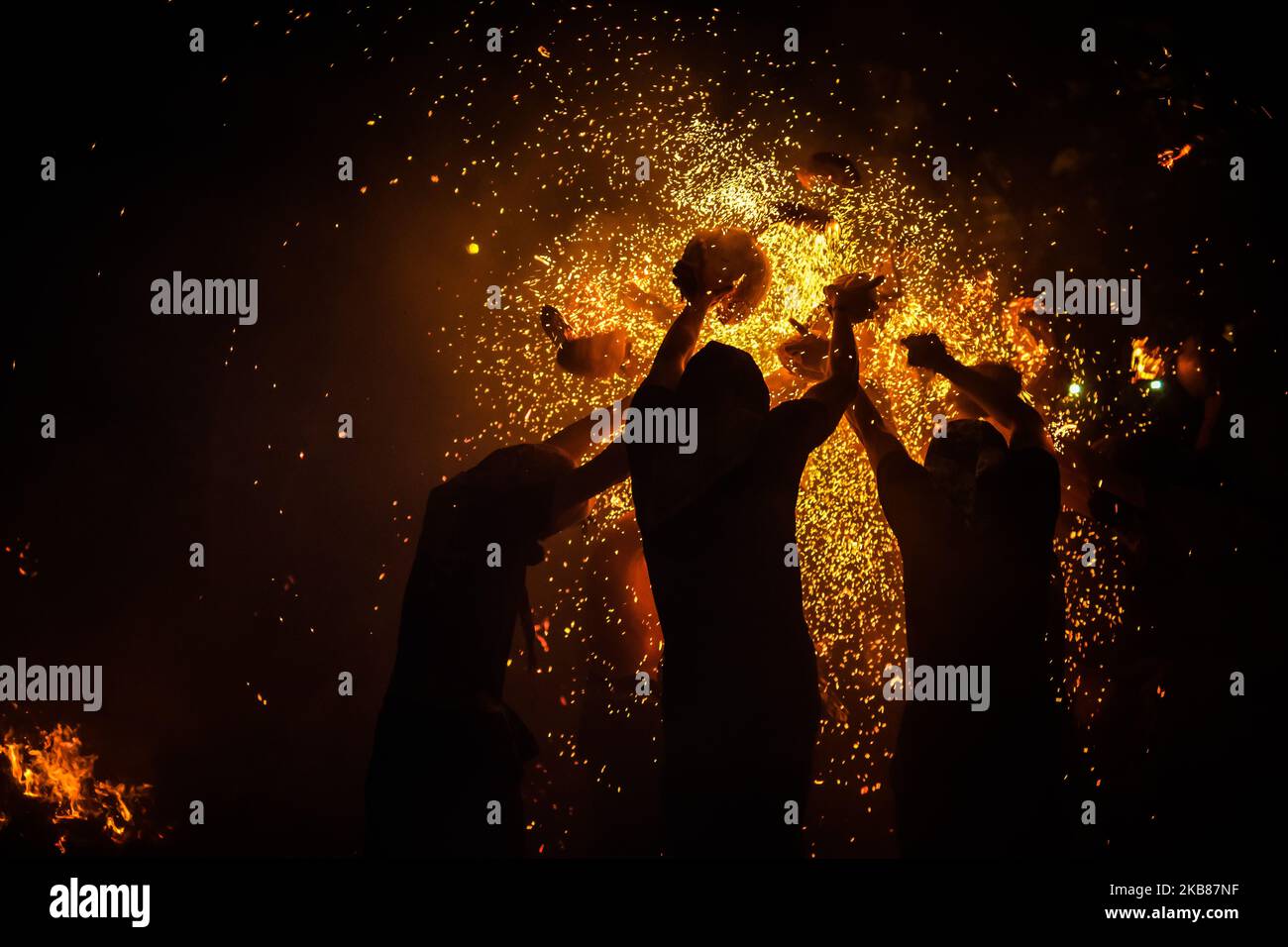 Dozens of Tuban village youths throwing coconut husks full of fire to ...