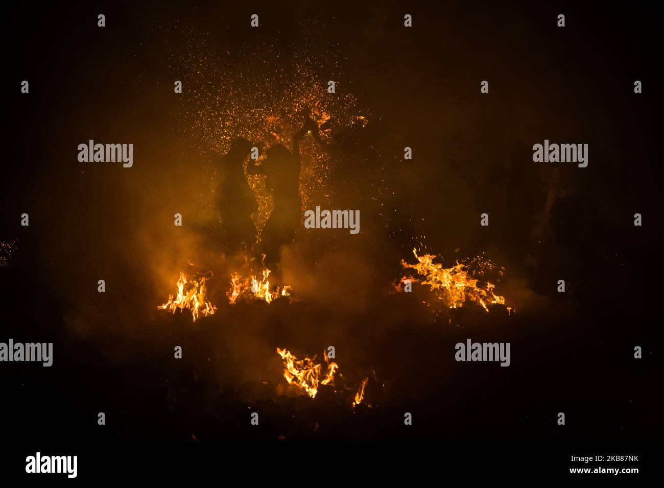 Dozens of Tuban village youths throwing coconut husks full of fire to ...