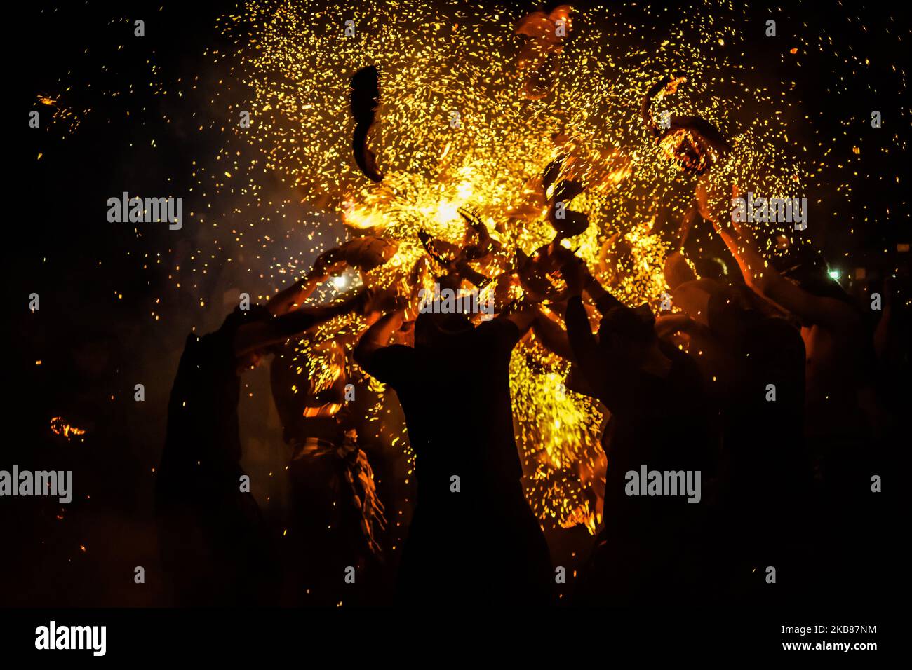 Dozens of Tuban village youths throwing coconut husks full of fire to ...