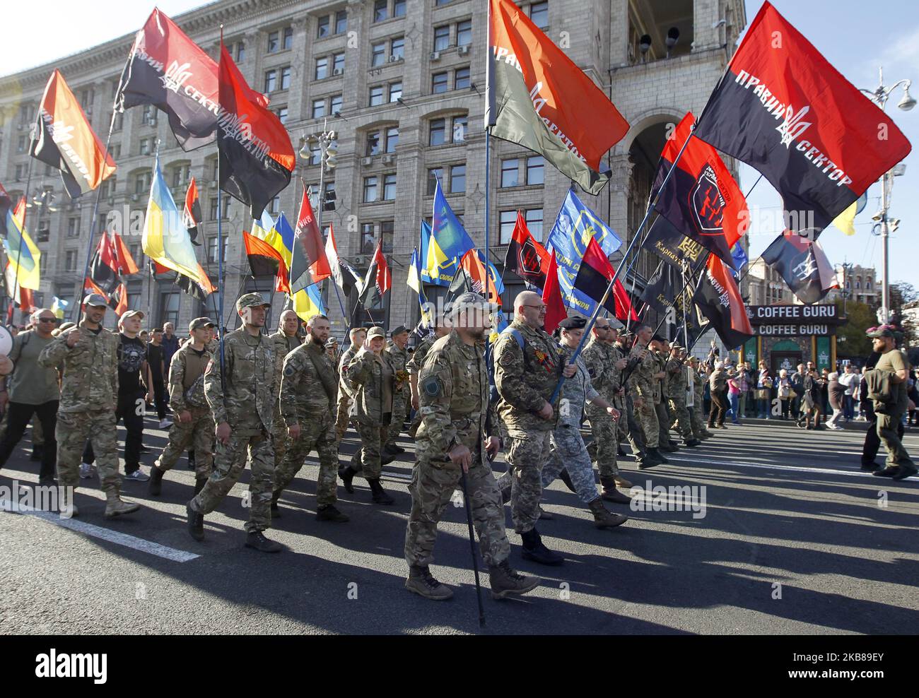 Ukrainians take part at a march to the 77th anniversary of the founding ...