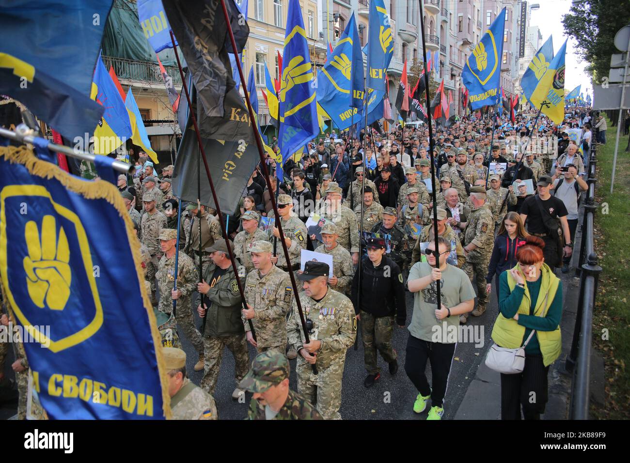 Ukrainians participate a march under the flags of far-right Svoboda ...