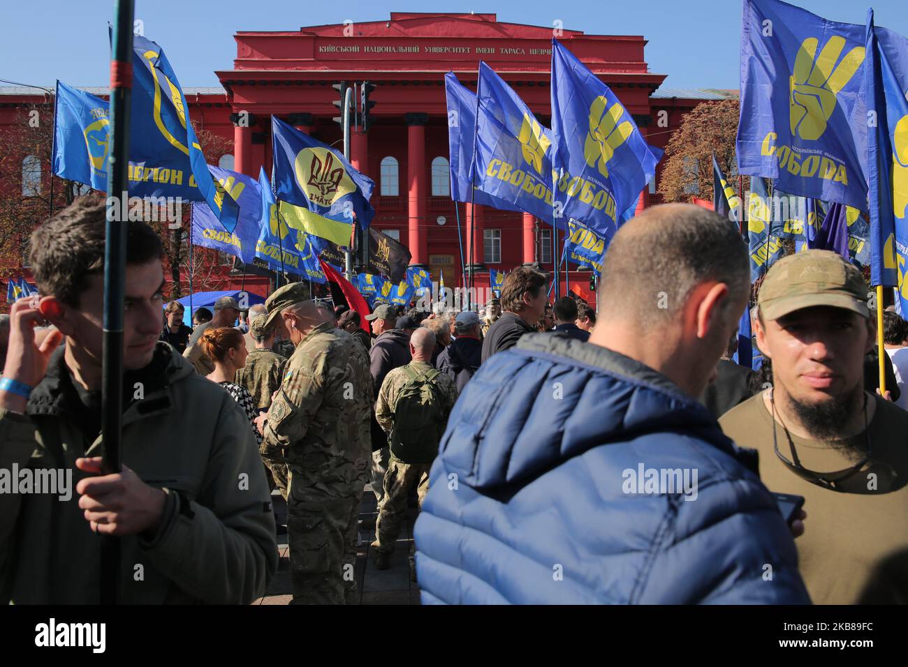 Ukrainians participate a march under the flags of far-right Svoboda ...