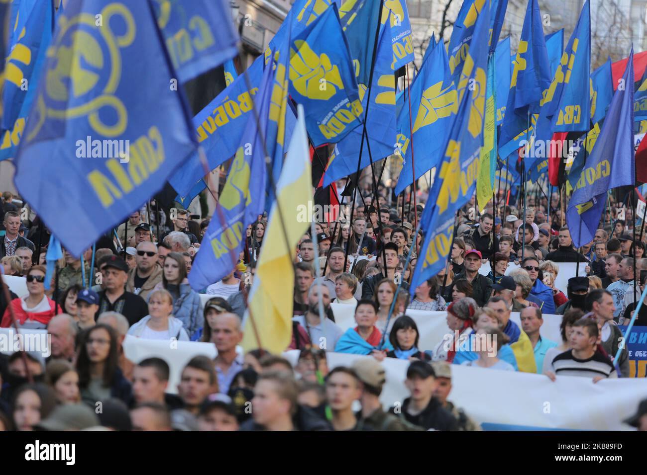 Ukrainians participate a march under the flags of far-right Svoboda ...
