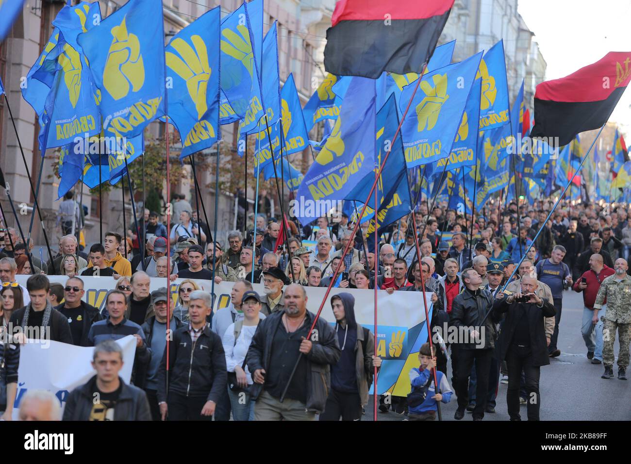 Ukrainians participate a march under the flags of far-right Svoboda ...