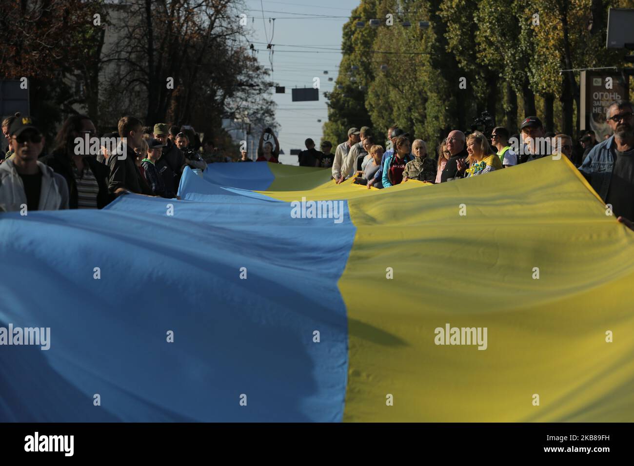 Ukrainians participate a march under the flags of far-right Svoboda ...