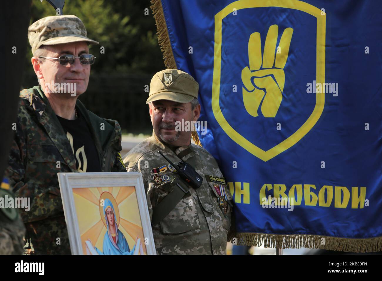 Ukrainians participate a march under the flags of far-right Svoboda ...