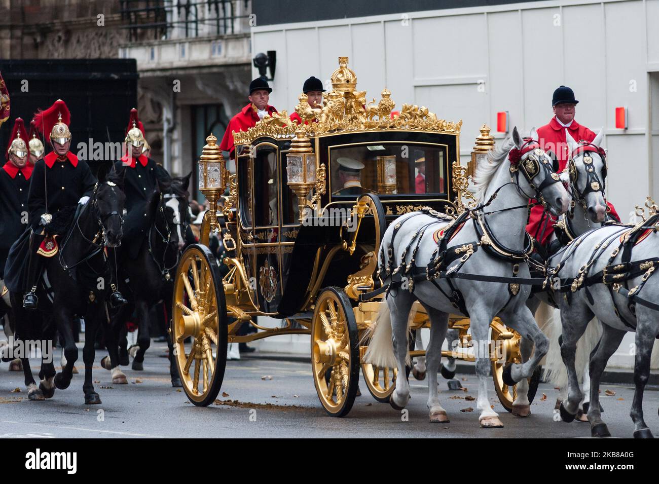 Britain's Queen Elizabeth II rides in the Diamond Jubilee State Coach ...