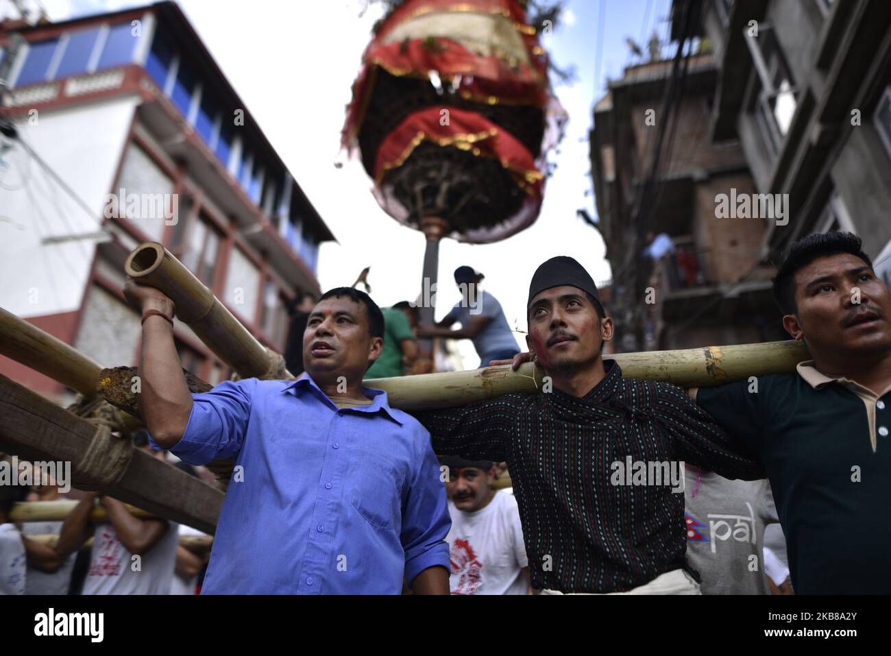 Locals carry as well as rotates top part of a chariot of Lord Narayan ...