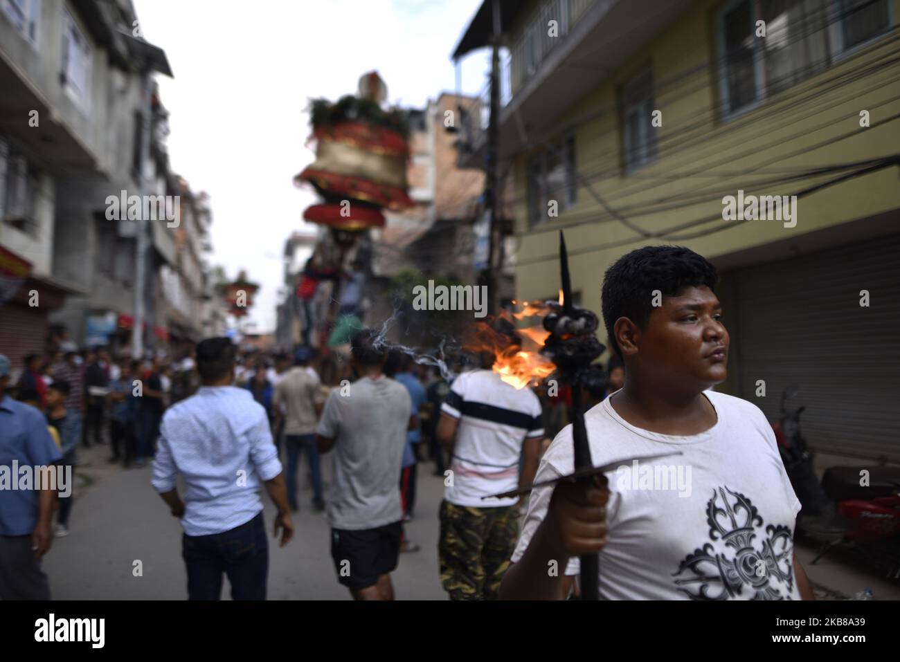 A Devotee carryingg fire torch during Lord Narayan jatra festival in ...