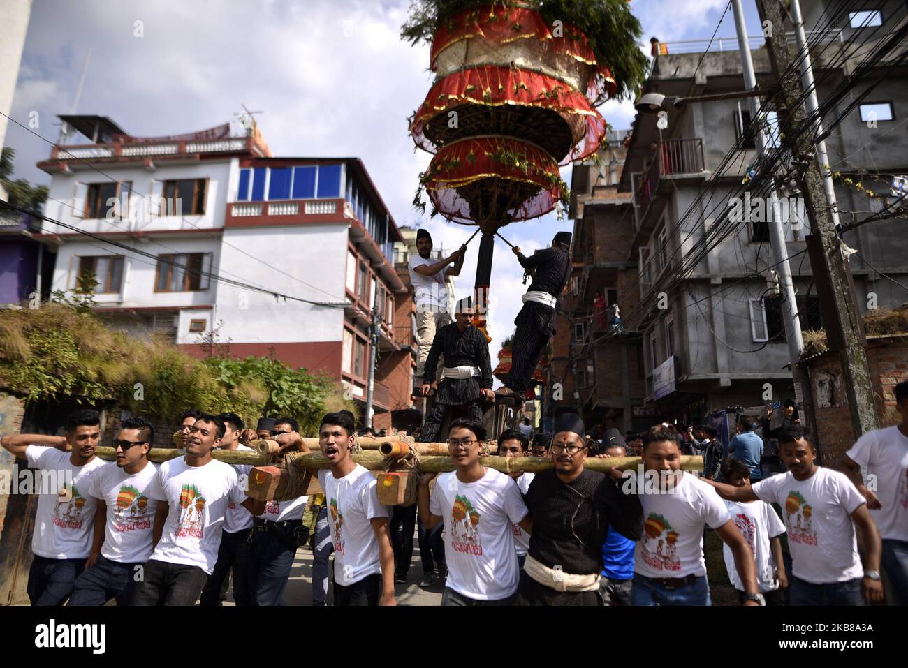 Locals carry as well as rotates top part of a chariot of Lord Narayan ...