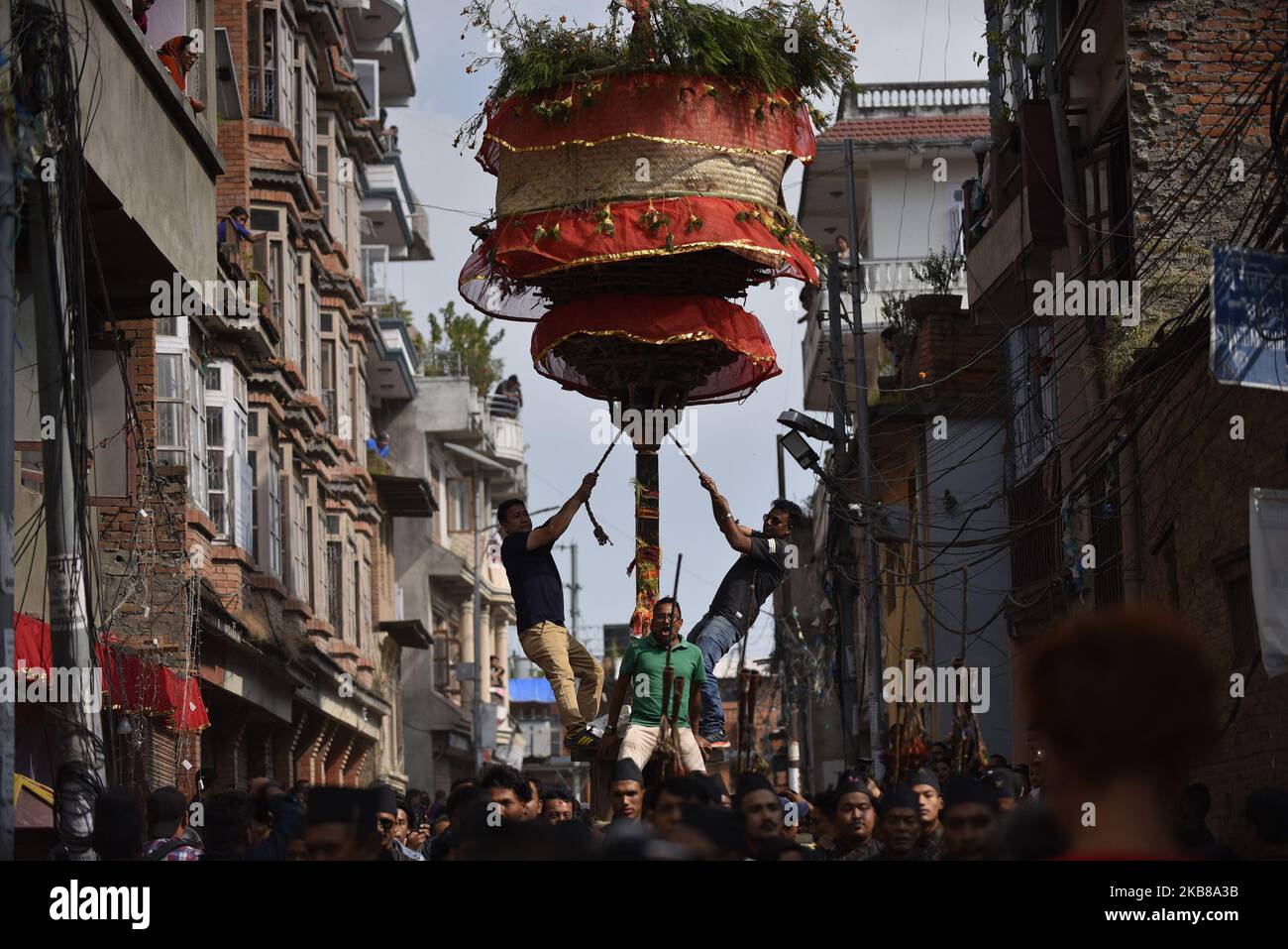 Locals carry as well as rotates top part of a chariot of Lord Narayan ...