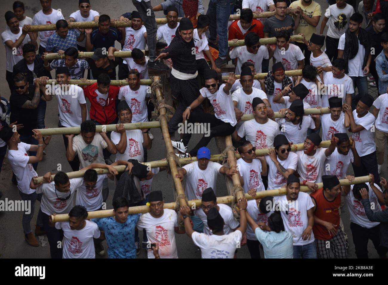 Locals carrying a chariot of Lord Narayan across the streets of ...