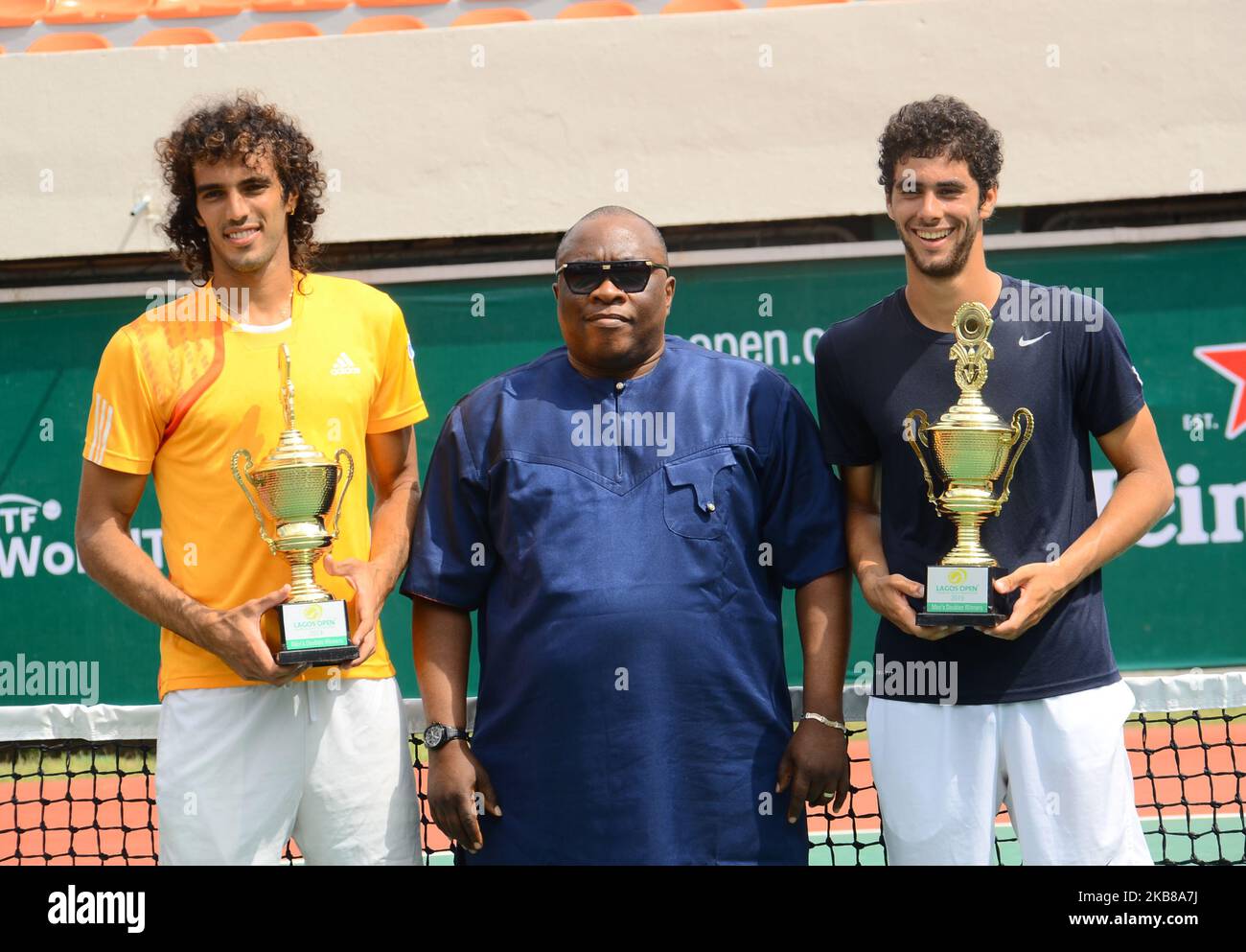 Tunisians Aziz Dougaz and Skander Monsouri pose with trophy after ...