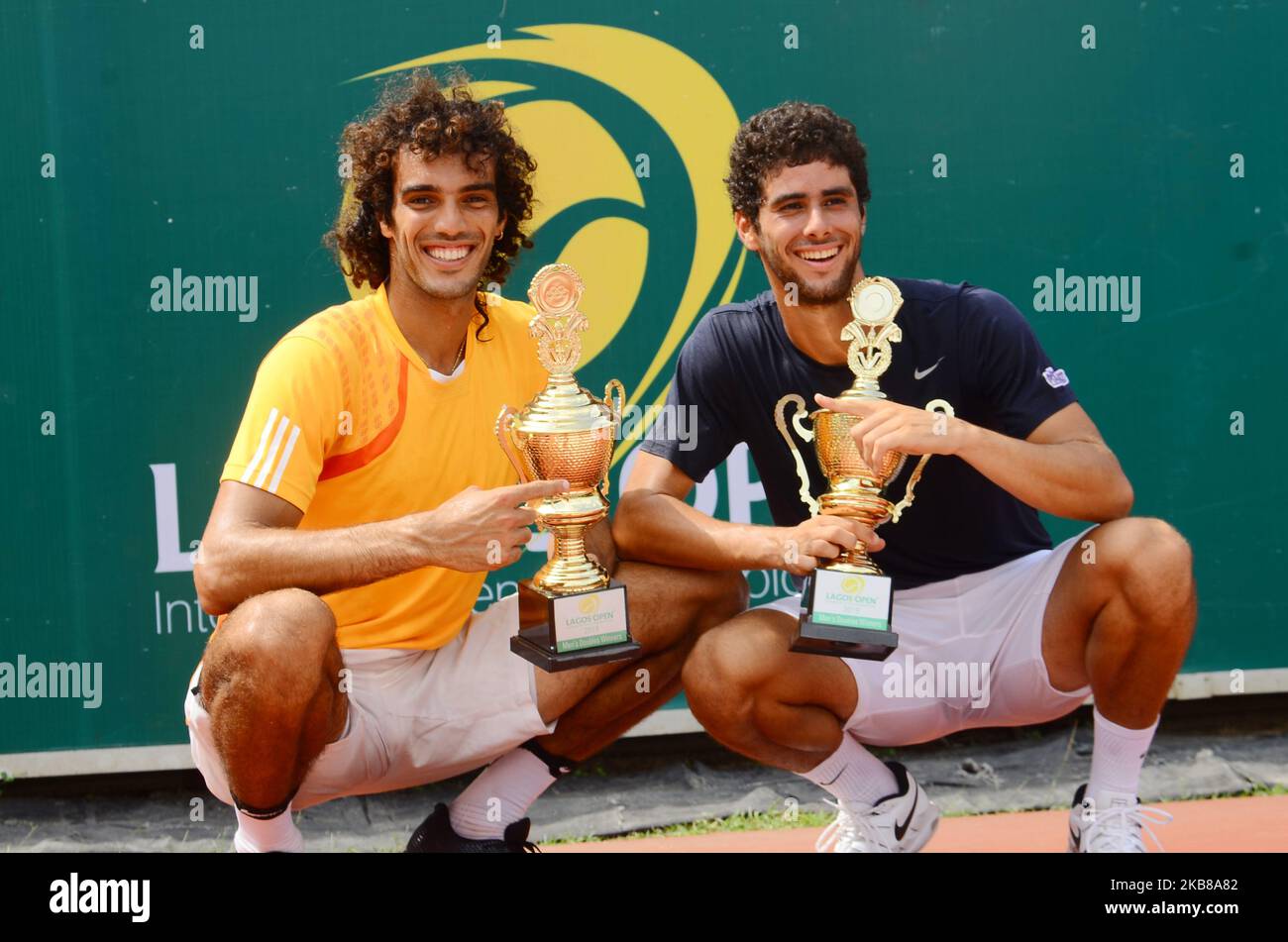 Tunisians Aziz Dougaz and Skander Monsouri pose with trophy after ...