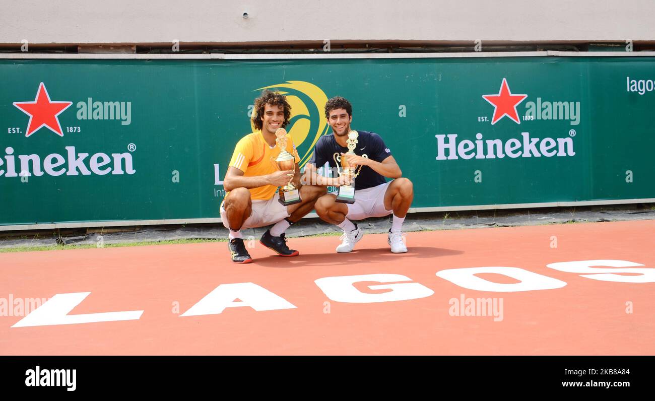Tunisians Aziz Dougaz and Skander Monsouri pose with trophy after ...