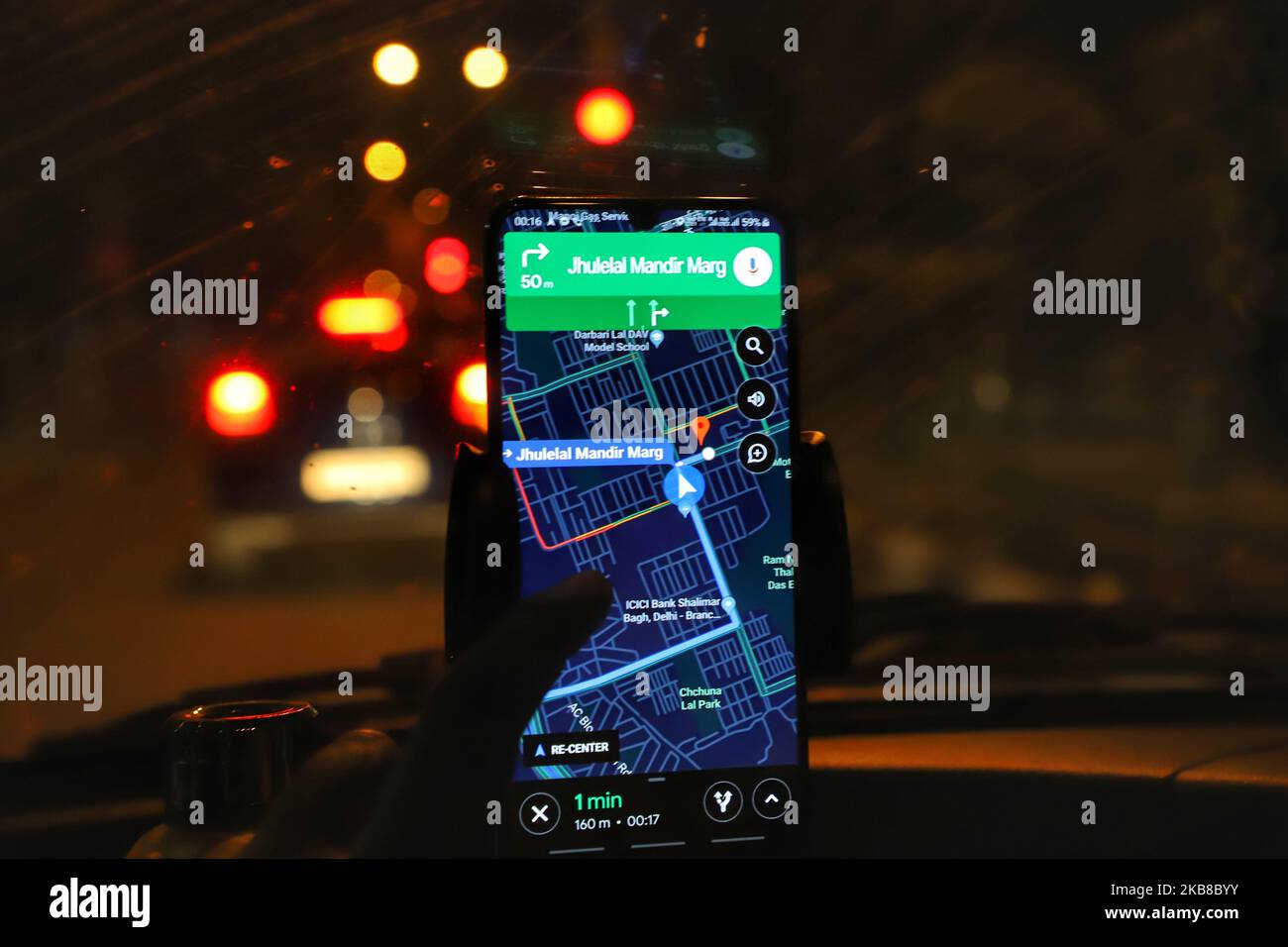 A driver uses Google Maps to track the location in New Delhi India on ...