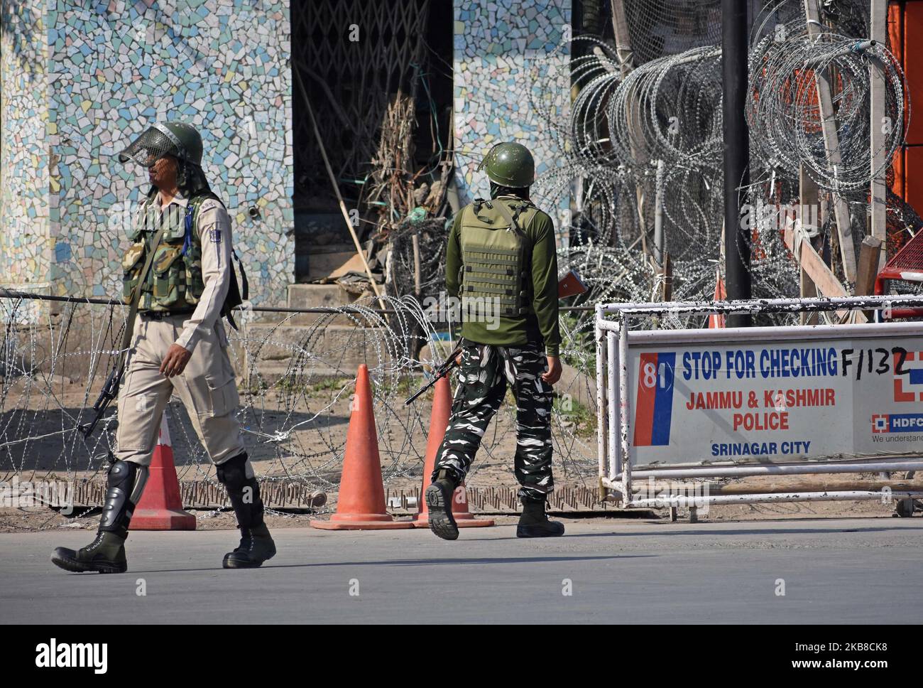 Indian paramilitary soldiers walks outside the military camp in ...
