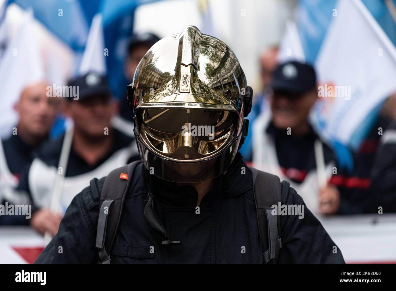 Portrait of a firefighter wearing emergency clothing wearing his ...