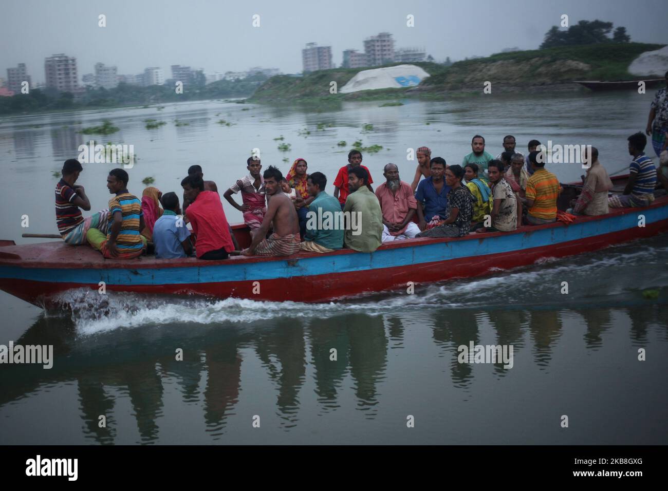 People seen crossing The Turag river through boat in Dhaka, Bangladesh ...
